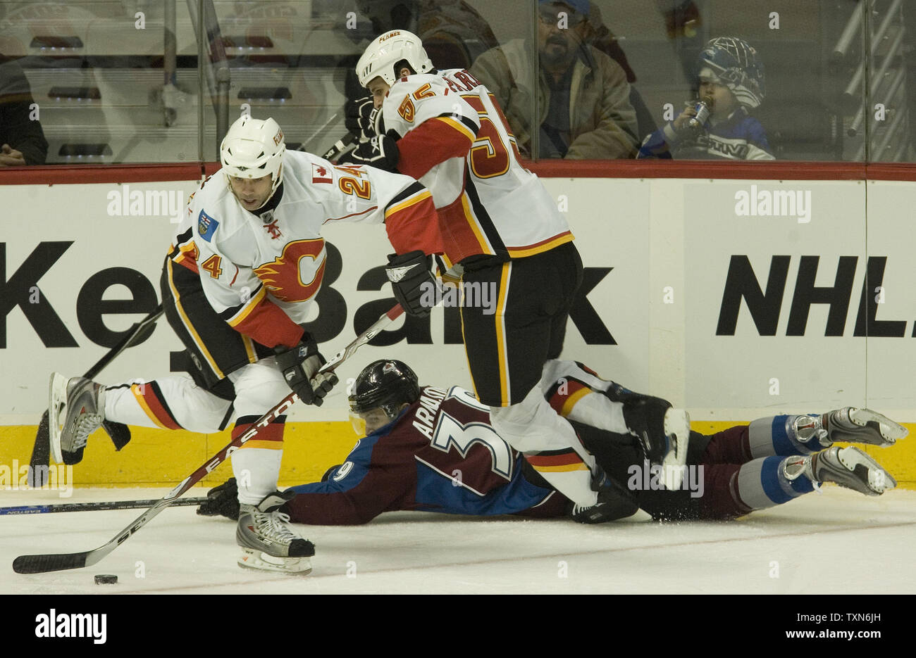 Calgary Flames center Craig Conroy (24) clears the puck after Flames ...