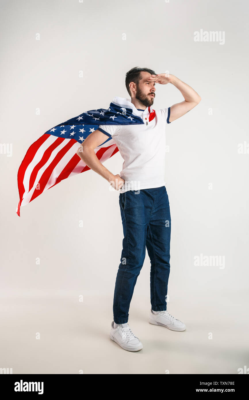 Celebrating an Independence day. Stars and Stripes. Young man with the ...