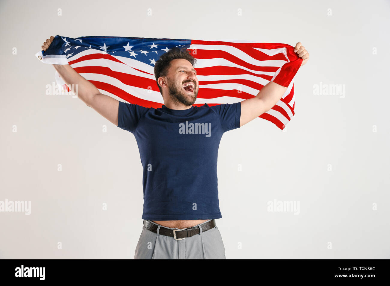 Celebrating an Independence day. Stars and Stripes. Young man with the ...
