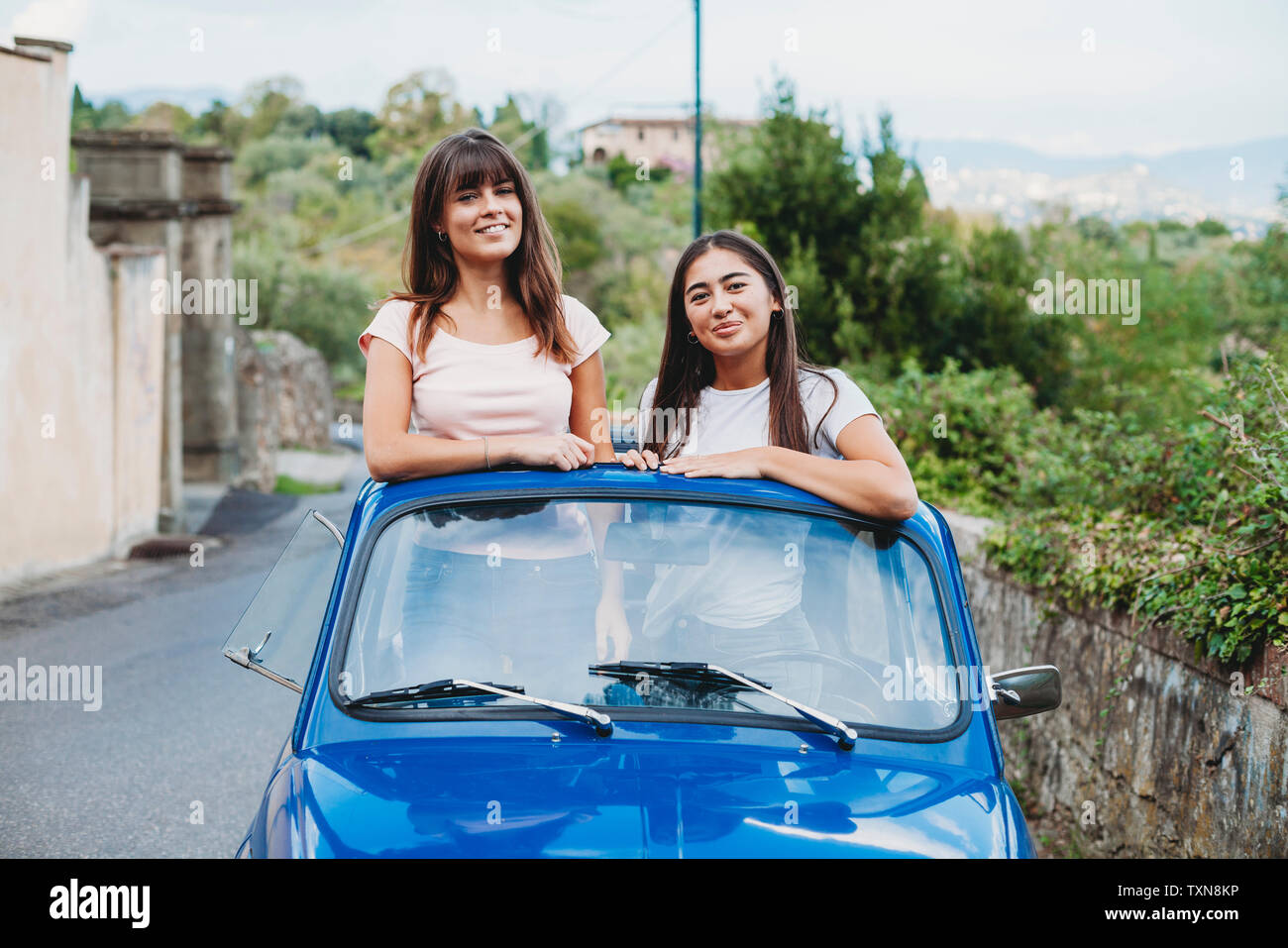 Getting into car sunroof hi-res stock photography and images - Alamy