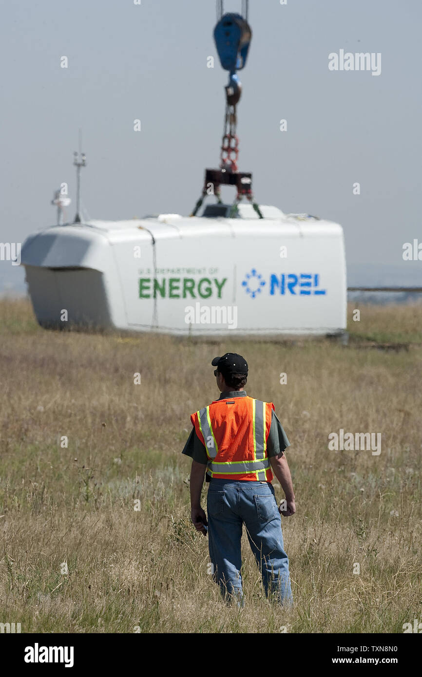 A Public Relations employee watches the progress of a new wind turbine ...