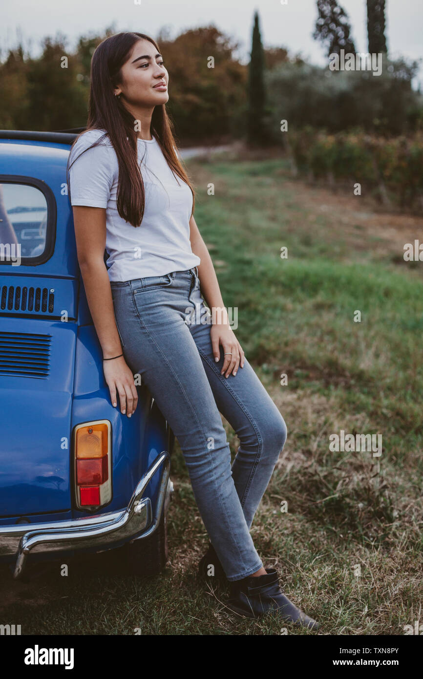 Woman leaning against car hi-res stock photography and images - Alamy
