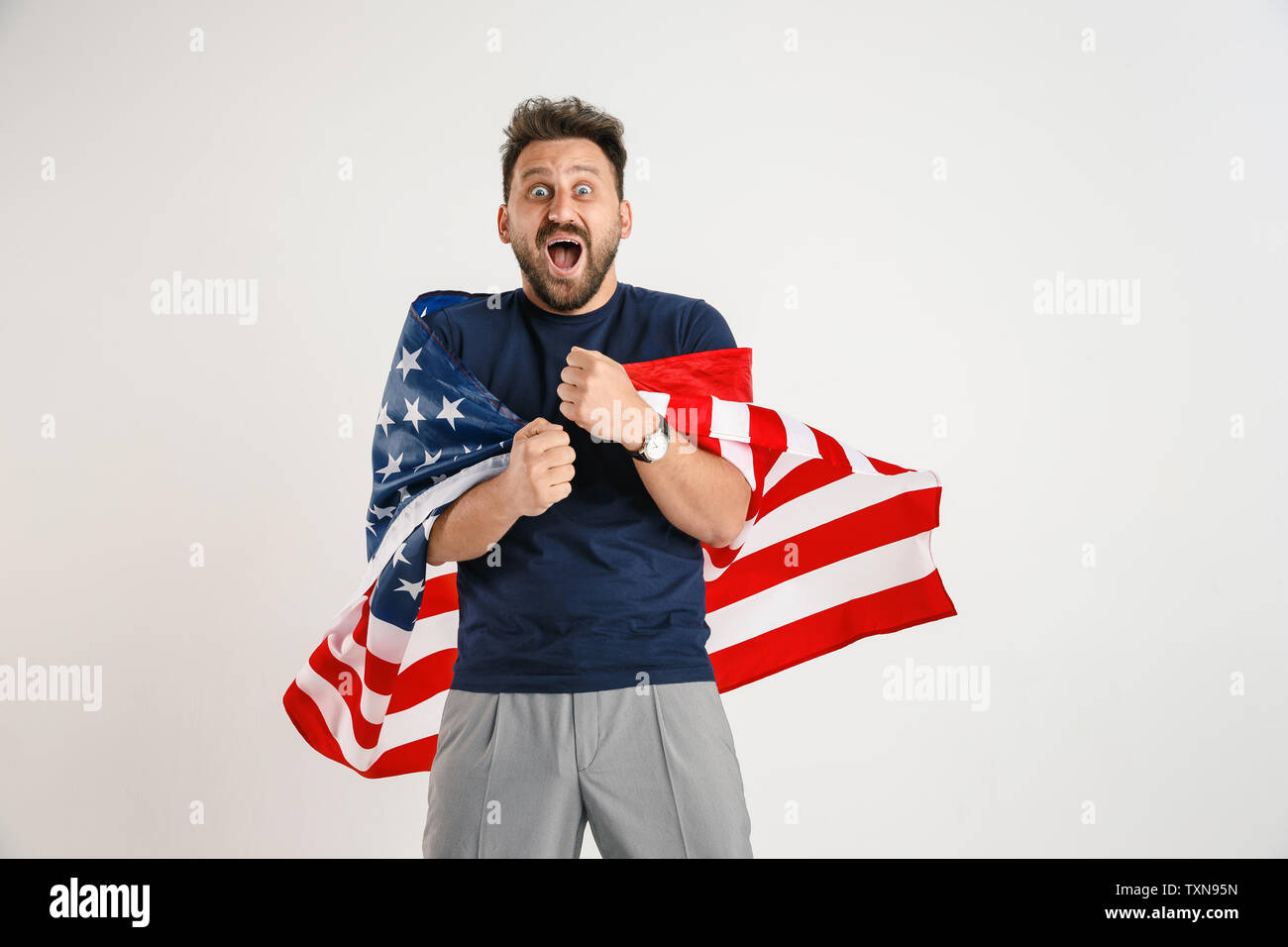 Celebrating an Independence day. Stars and Stripes. Young man with the ...