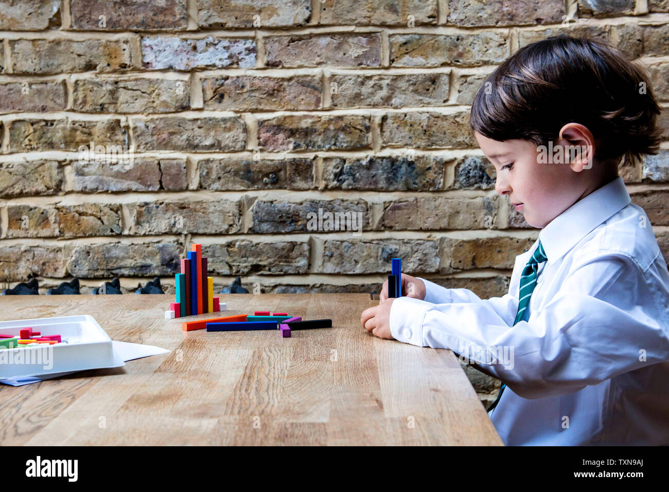 Child playing school uniform hi-res stock photography and images - Alamy