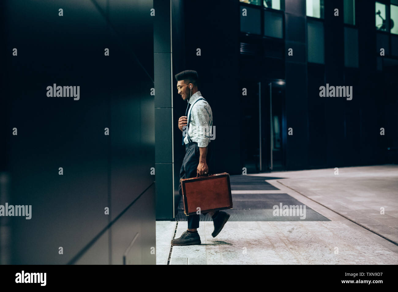 Businessman entering office building hi-res stock photography and ...