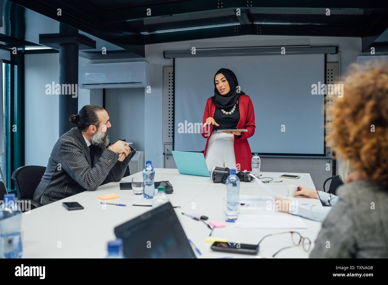 Business partners at brainstorming meeting in office Stock Photo - Alamy