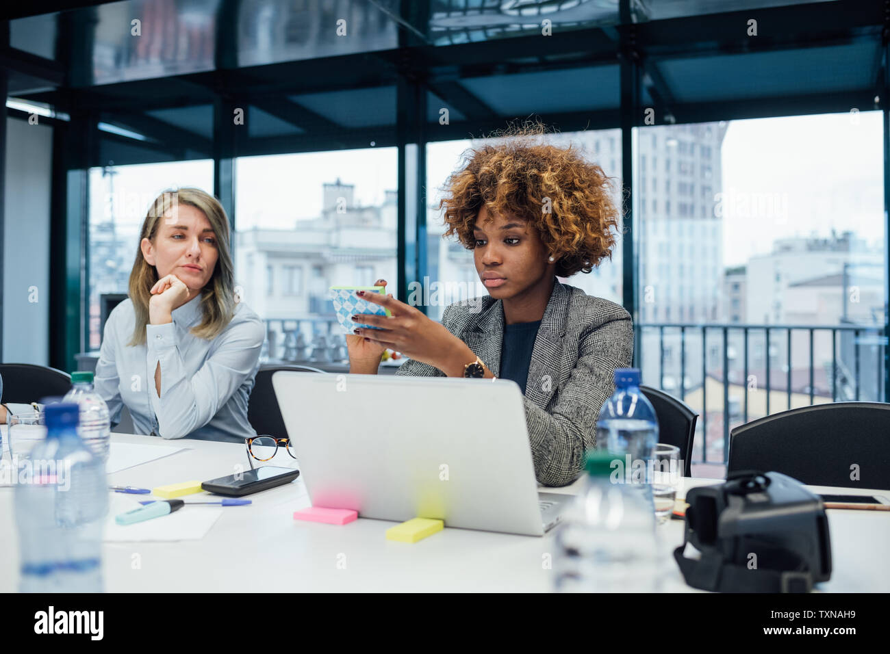 Business partners at brainstorming meeting in office Stock Photo - Alamy