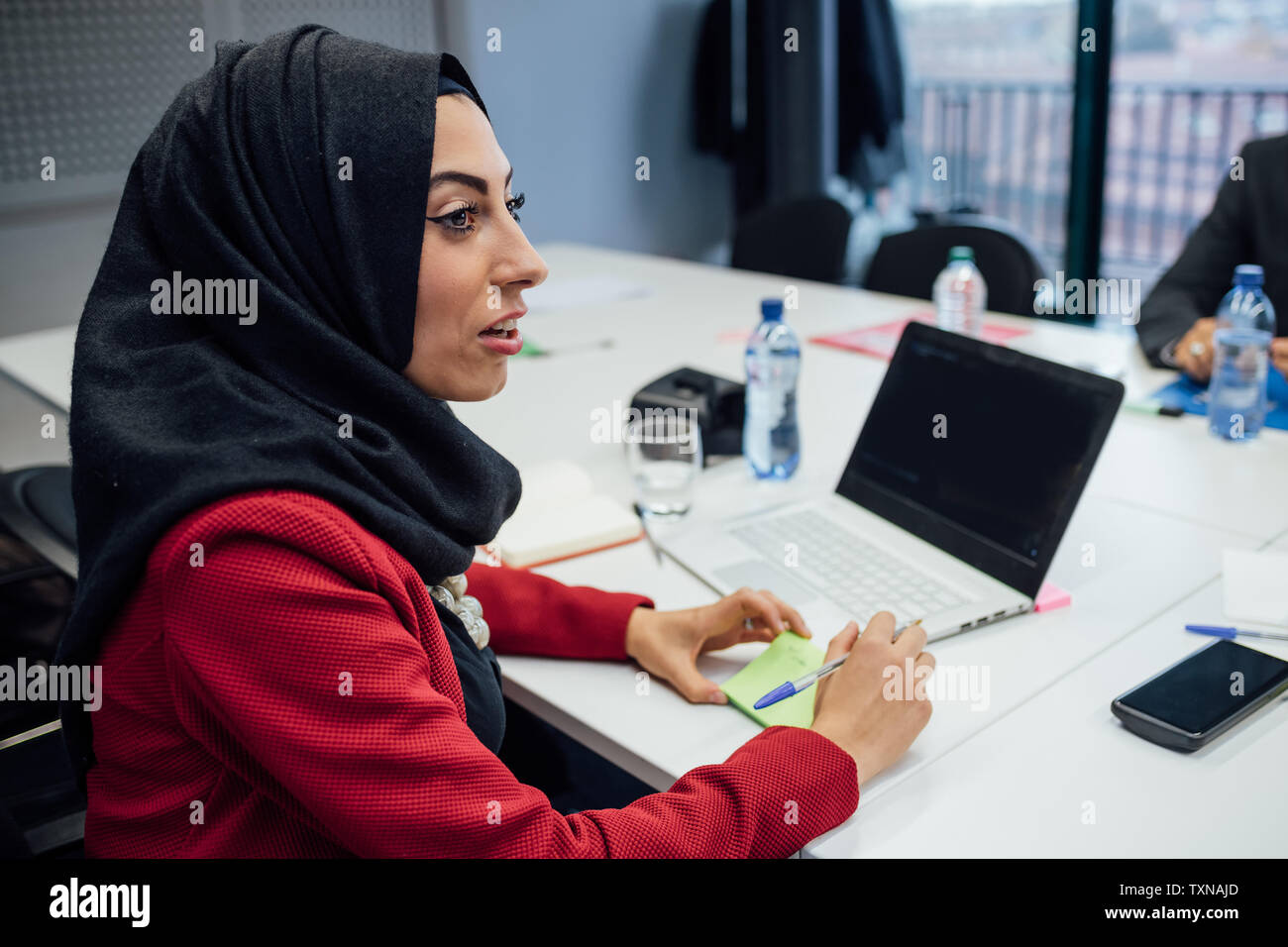 Business partners at brainstorming meeting in office Stock Photo - Alamy