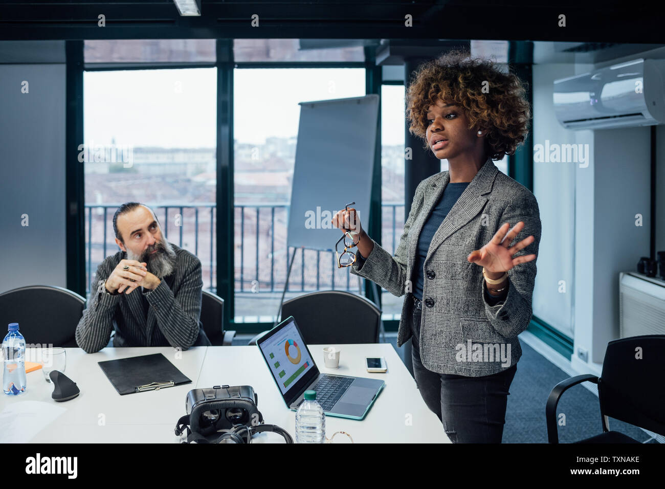 Business partners at brainstorming meeting in office Stock Photo - Alamy