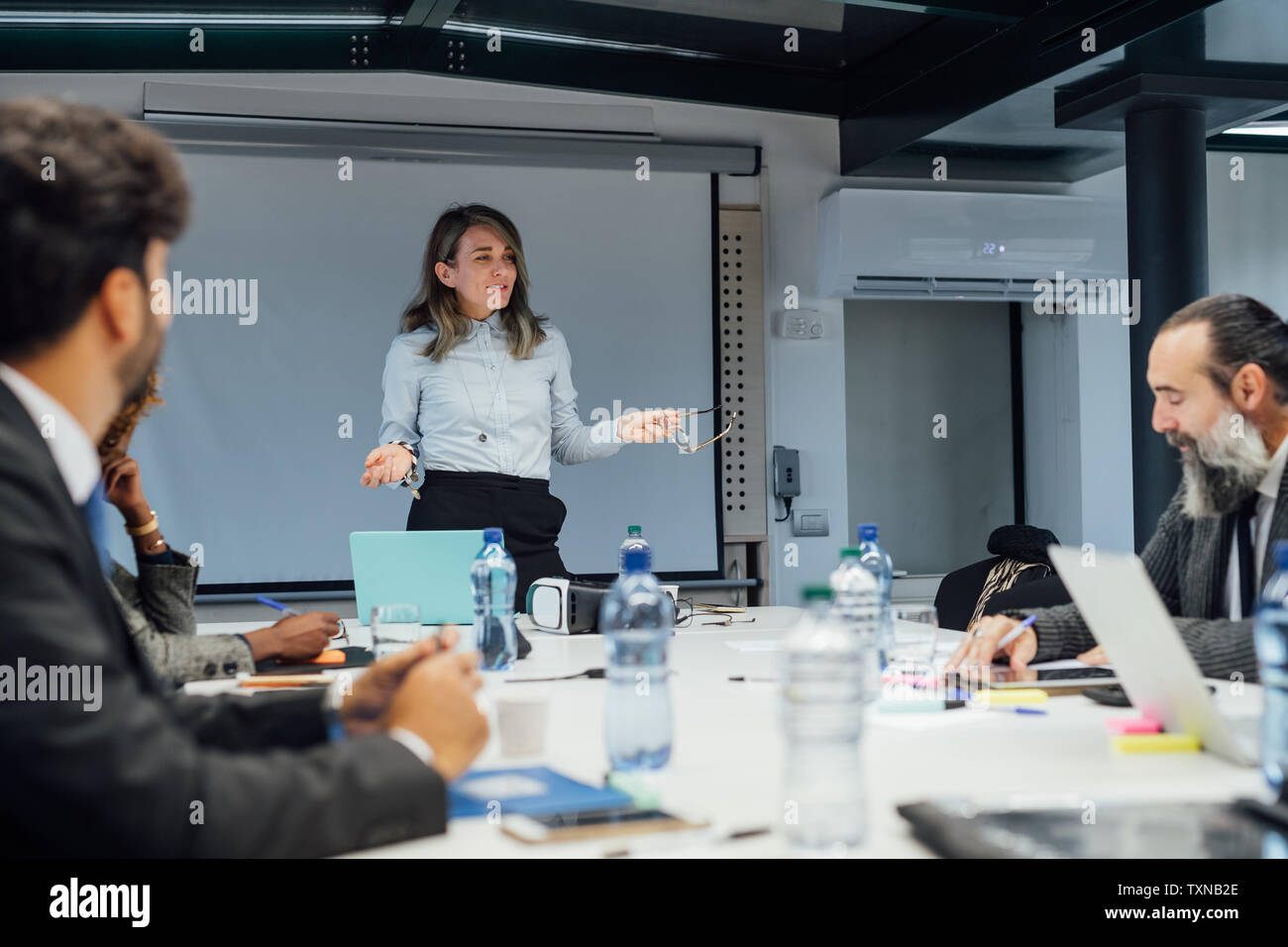 Business partners at brainstorming meeting in office Stock Photo - Alamy
