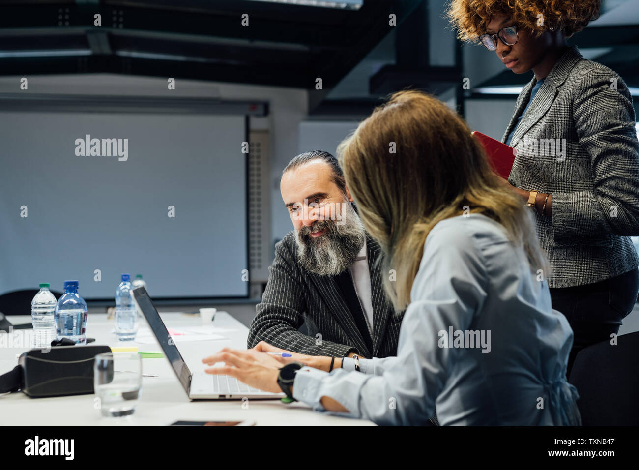 Business partners at brainstorming meeting in office Stock Photo - Alamy