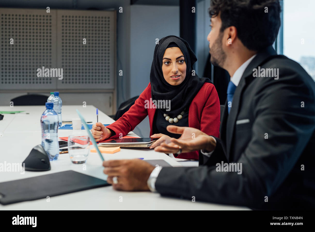 Business partners at brainstorming meeting in office Stock Photo - Alamy