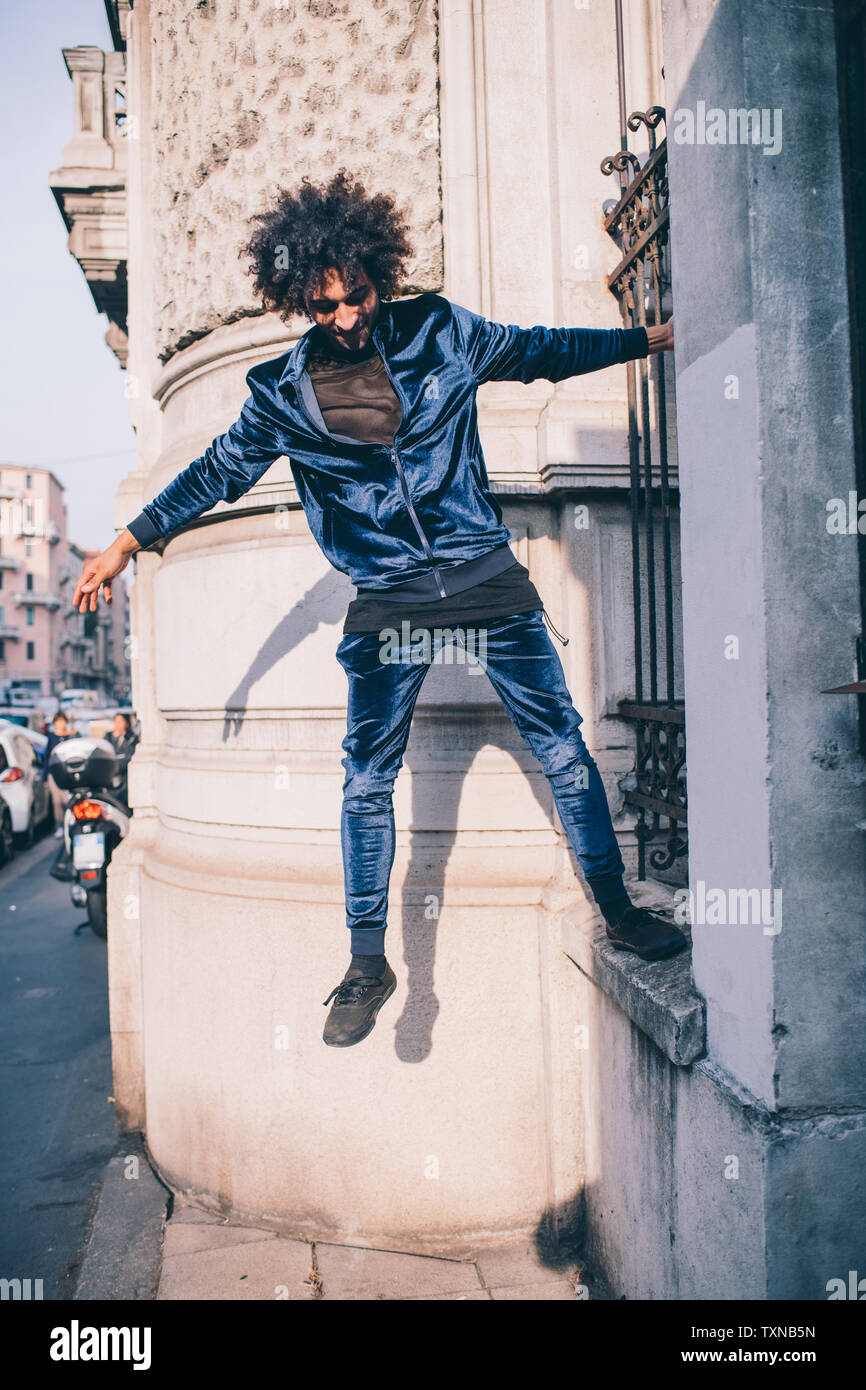 Man balancing on ledge on hi-res stock photography and images - Alamy