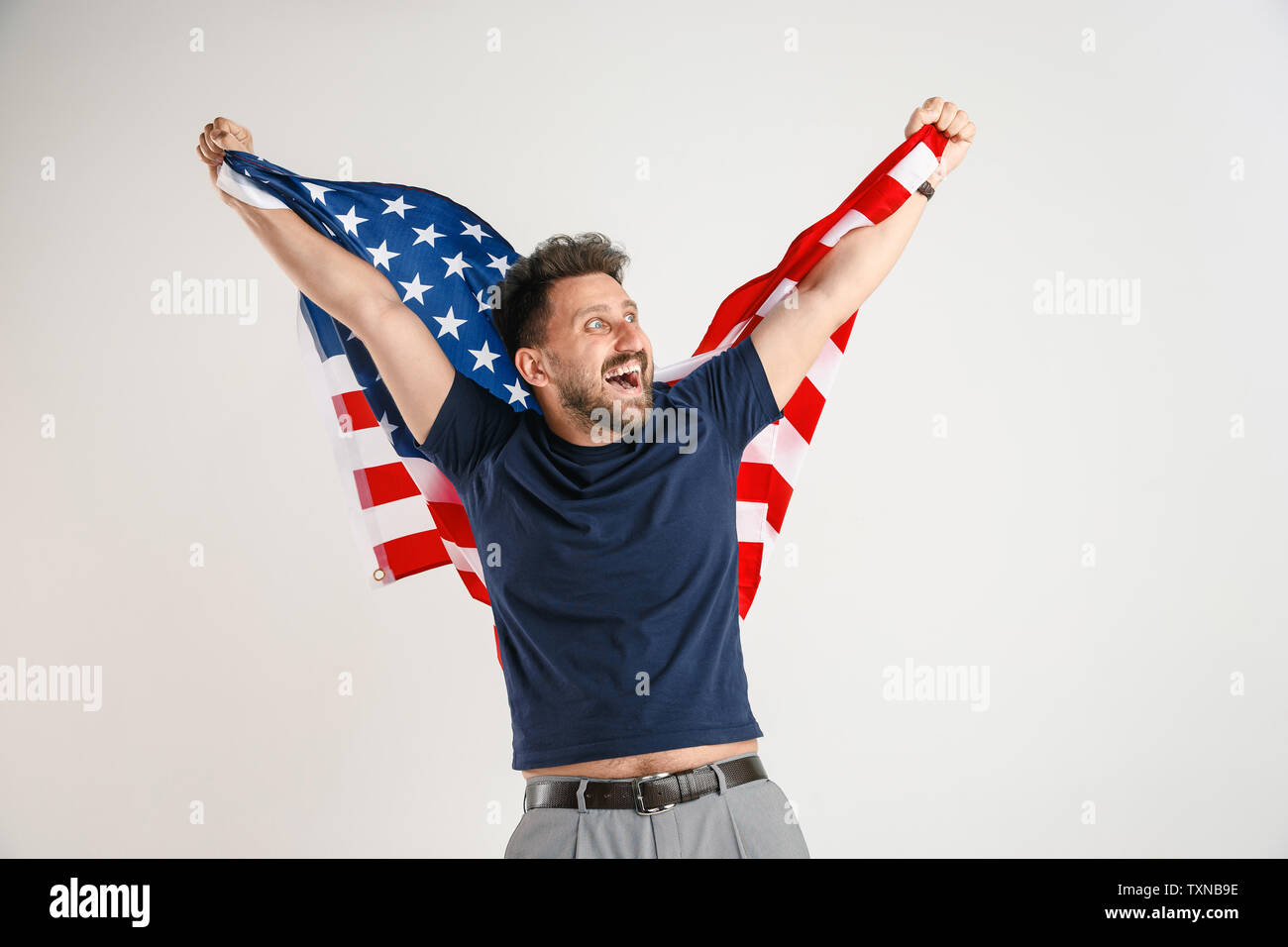 Celebrating an Independence day. Stars and Stripes. Young man with the ...