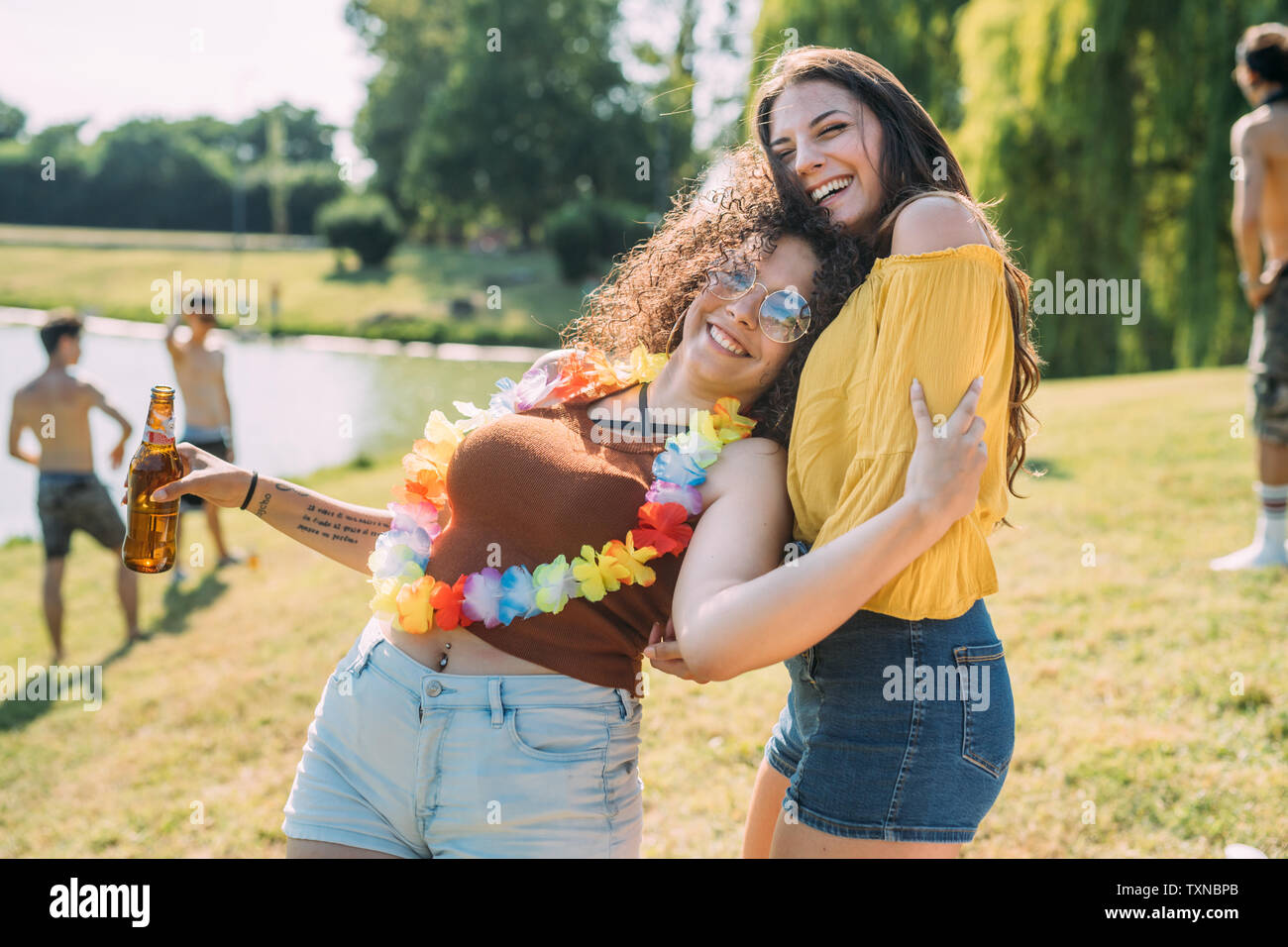 Male friends hugging hi-res stock photography and images - Alamy
