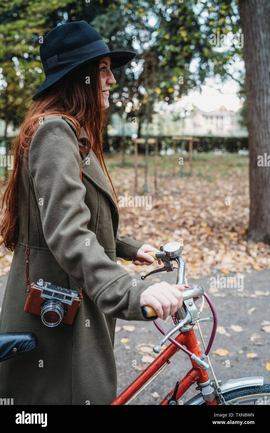 Woman pushing her bicycle hi-res stock photography and images - Alamy