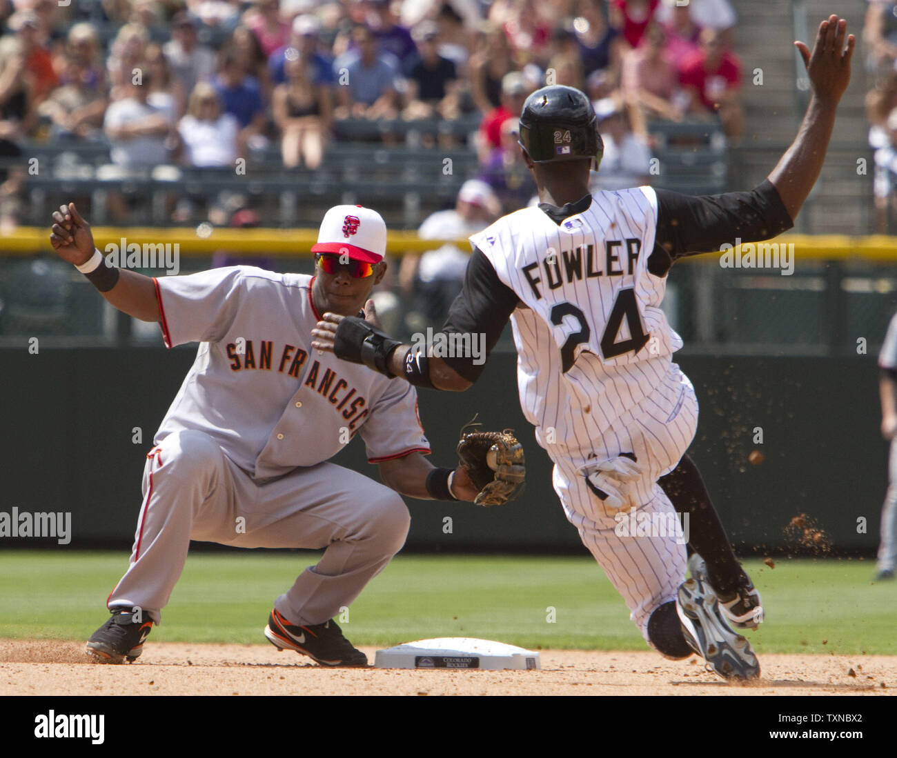 San Francisco Giants shortstop Edgar Renteria (L) tags out Colorado ...