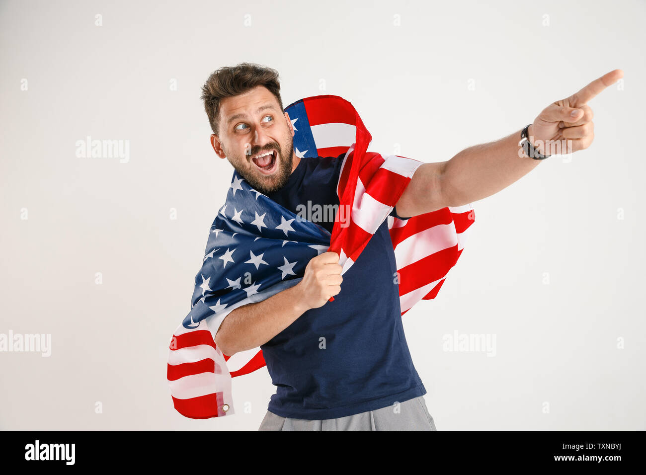 Celebrating an Independence day. Stars and Stripes. Young man with the ...