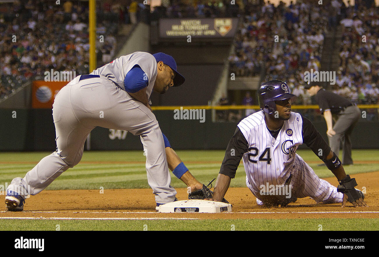 Chicago Cubs first baseman Derrek Lee takes the throw on a pick off ...