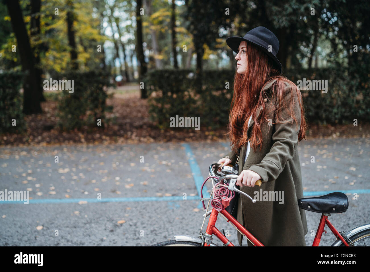 Woman pushing her bicycle hi-res stock photography and images - Alamy