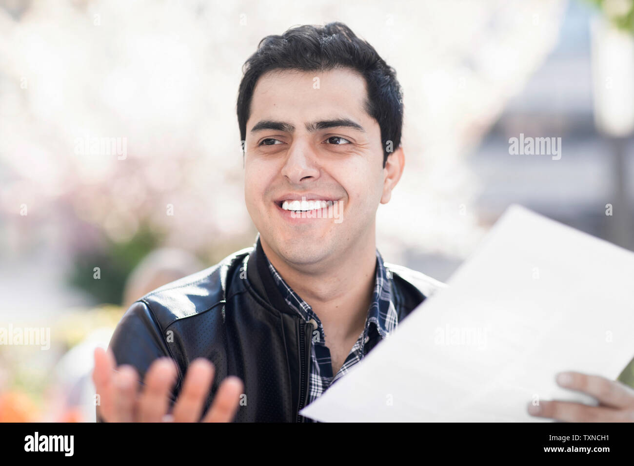 Young happy middle eastern man hi-res stock photography and images - Alamy
