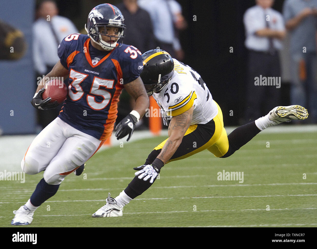 Denver Broncos running back Lance Ball (35) gains ten yards on a pass ...