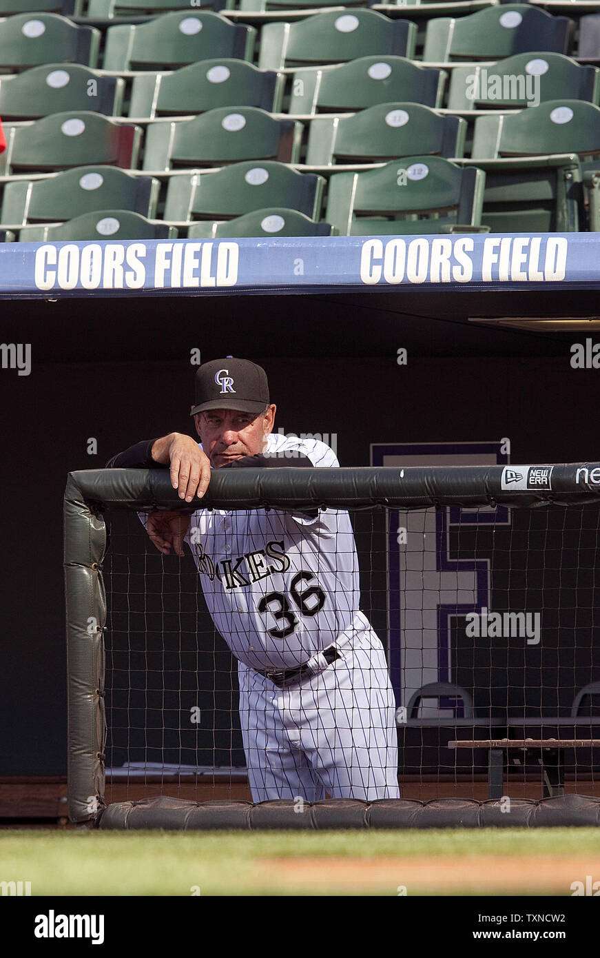 Colorado Rockies pitching coach Bob Apodaca leans on the dugout fence ...