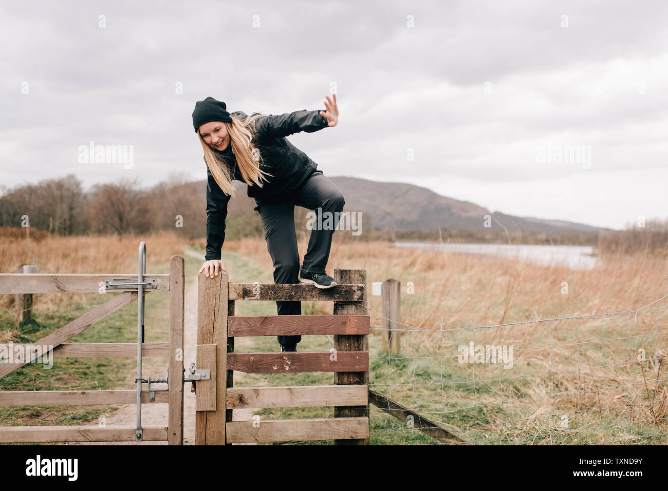 Climbing over fence hi-res stock photography and images - Alamy