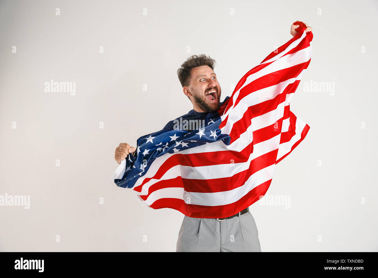 Celebrating an Independence day. Stars and Stripes. Young man with the ...