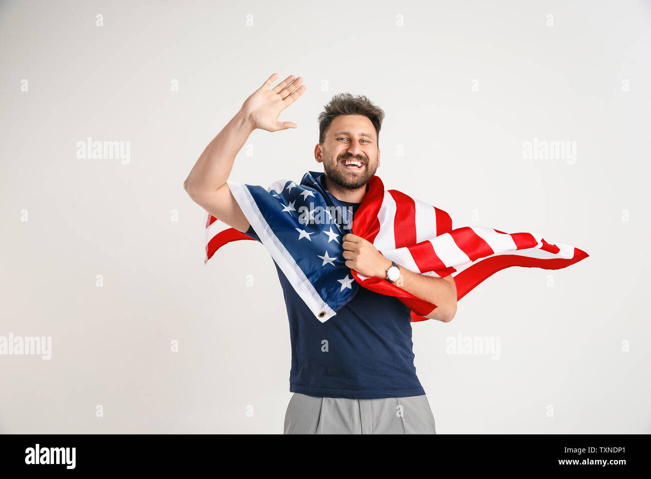 Celebrating an Independence day. Stars and Stripes. Young man with the ...