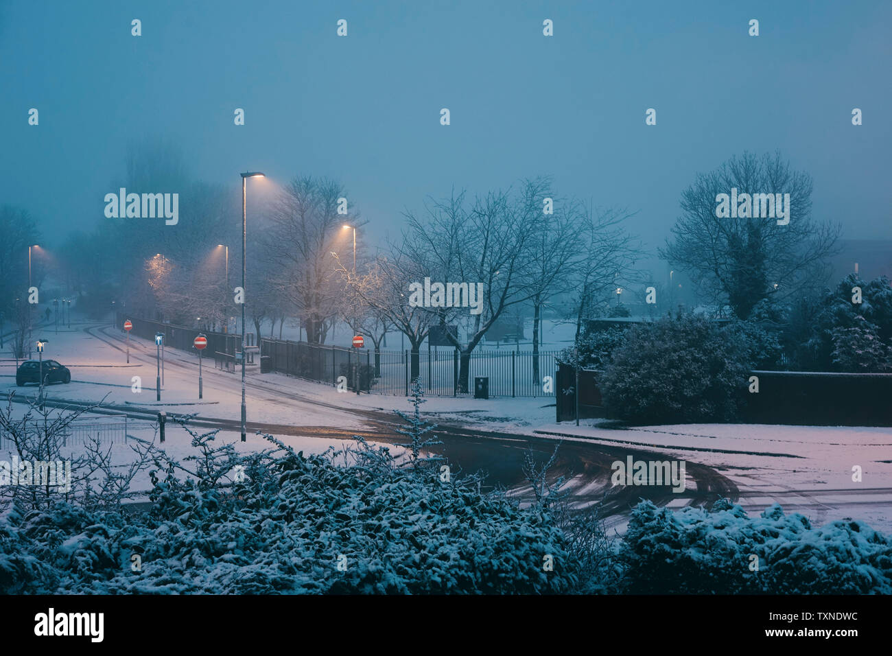 Snow-covered street and park, Manchester, UK Stock Photo - Alamy