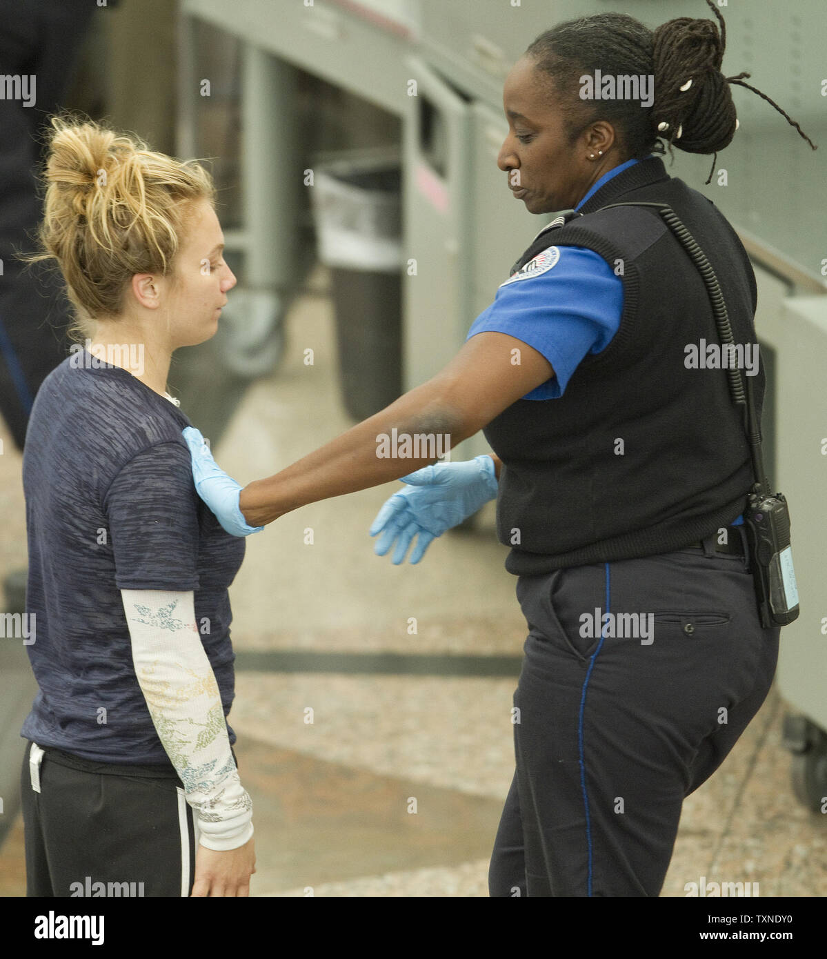 Pat down hi-res stock photography and images - Alamy