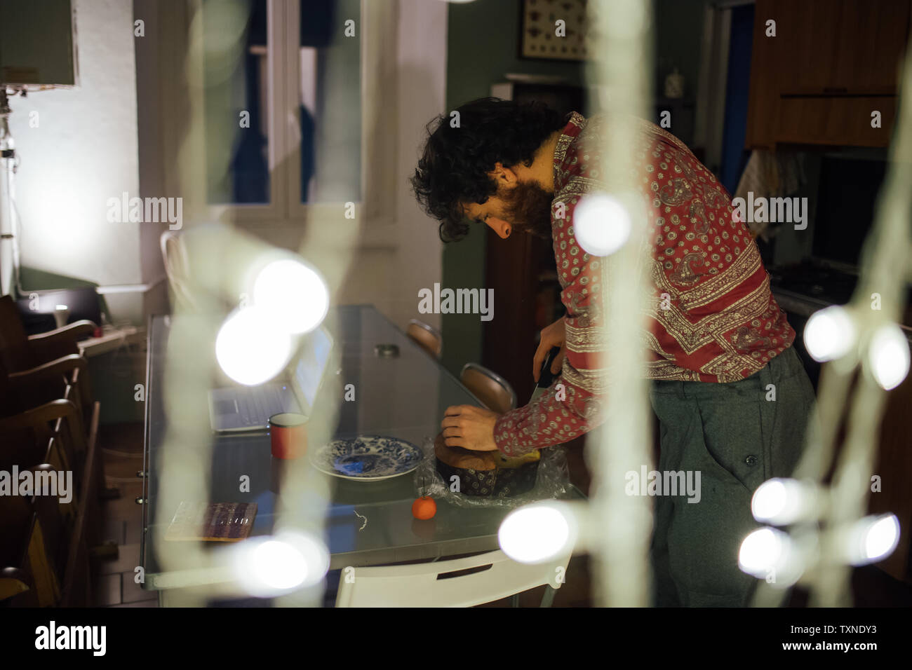 Male cutting bread hi-res stock photography and images - Alamy