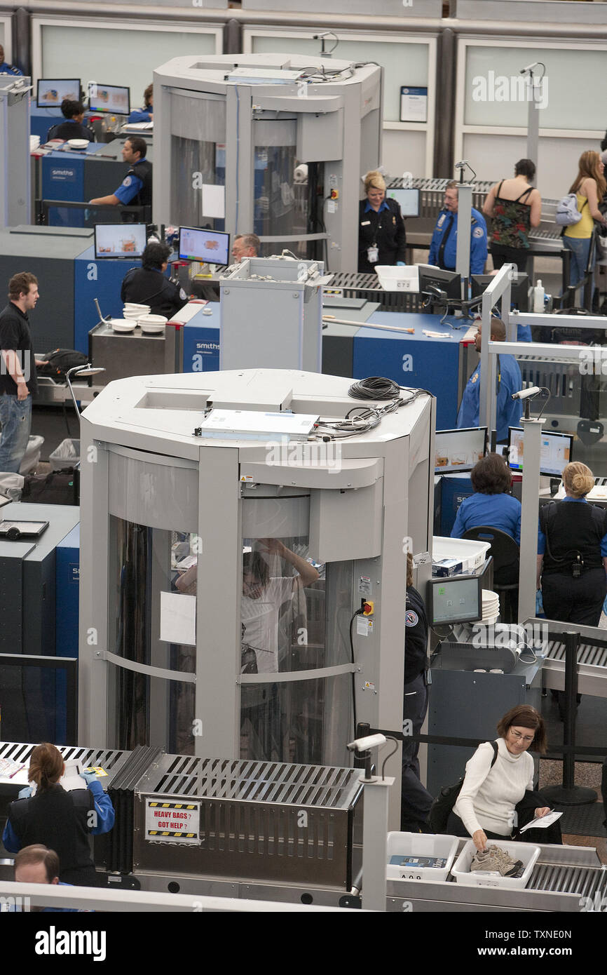 Transportation Security Administration (TSA) agents utilize two full ...
