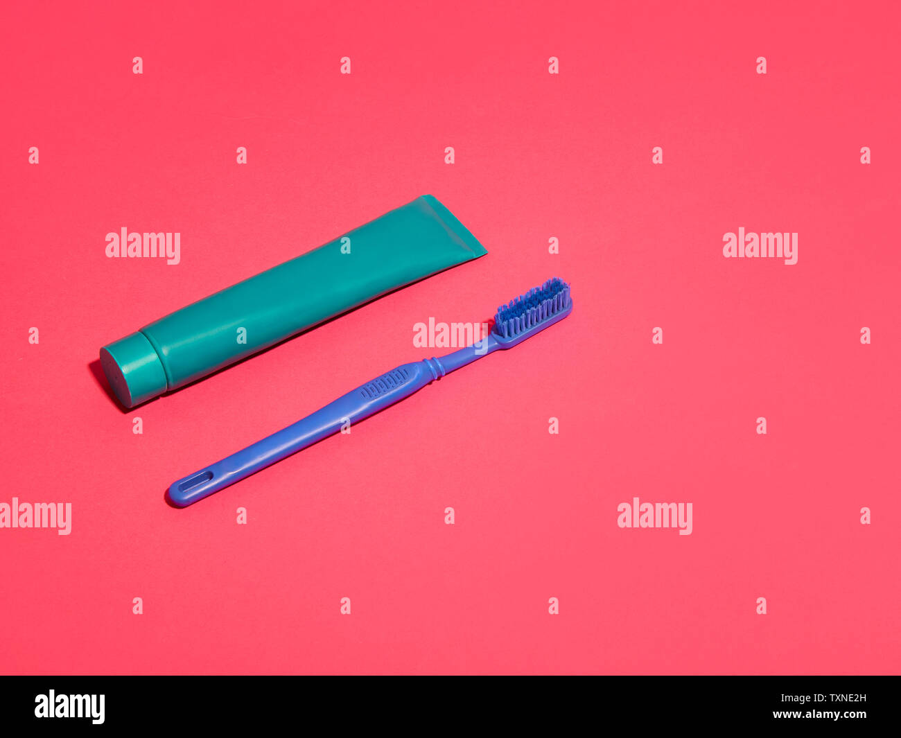 Toothbrush toothpaste blue background hi-res stock photography and ...