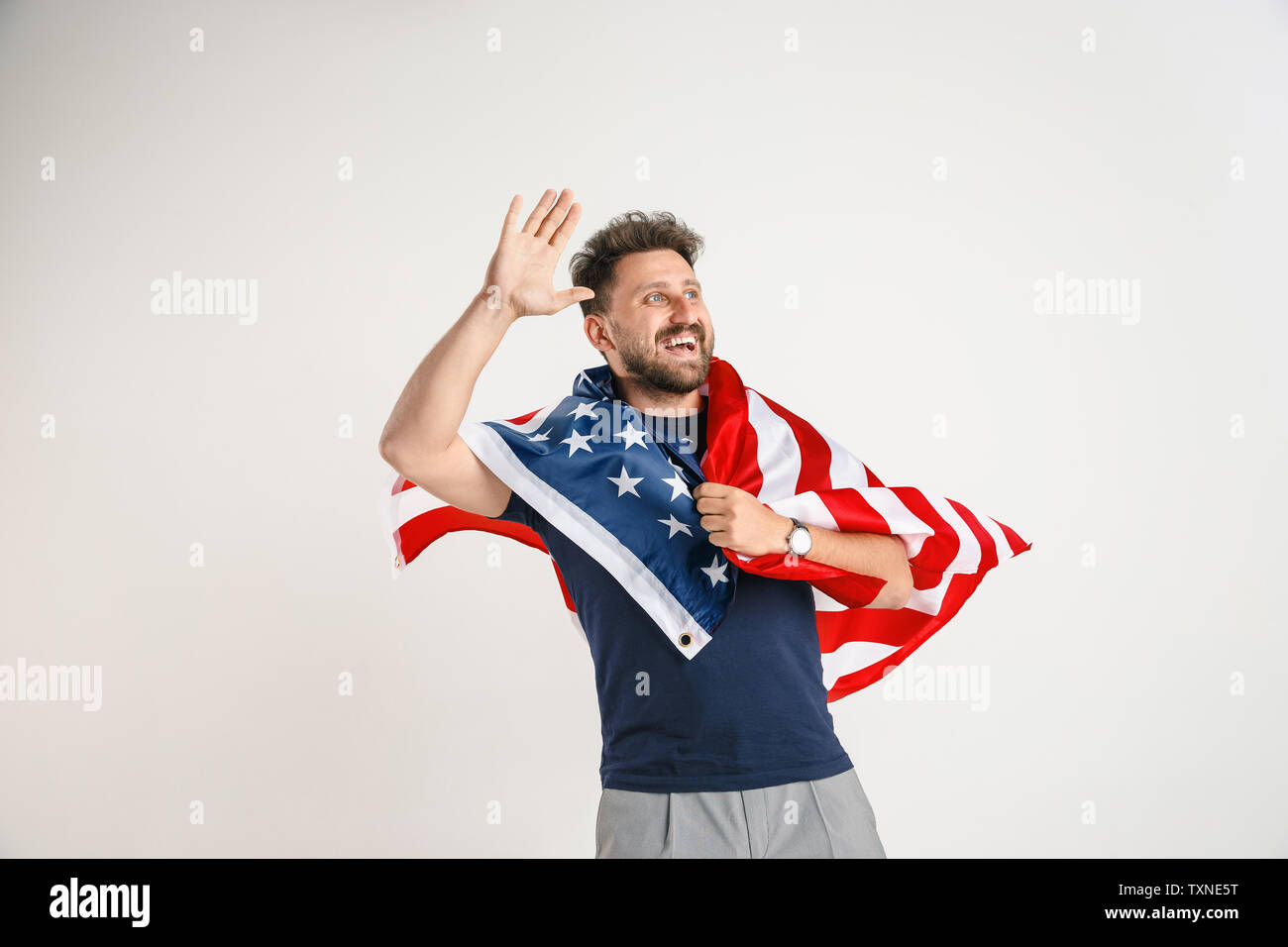 Celebrating an Independence day. Stars and Stripes. Young man with the ...
