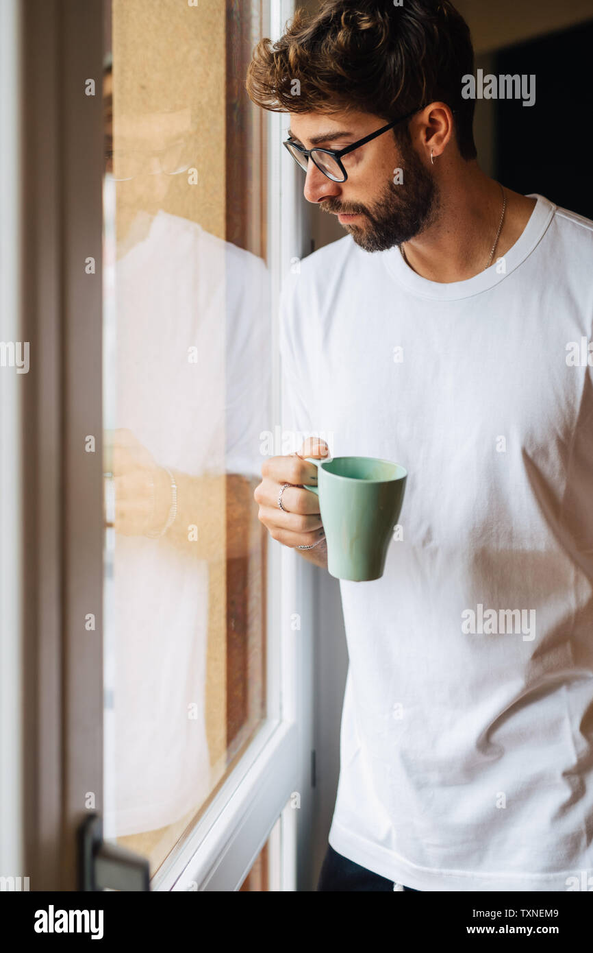Man apartment window hi-res stock photography and images - Alamy
