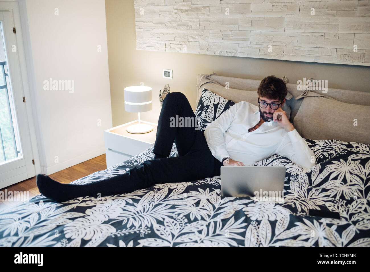 Reclining man hi-res stock photography and images - Alamy