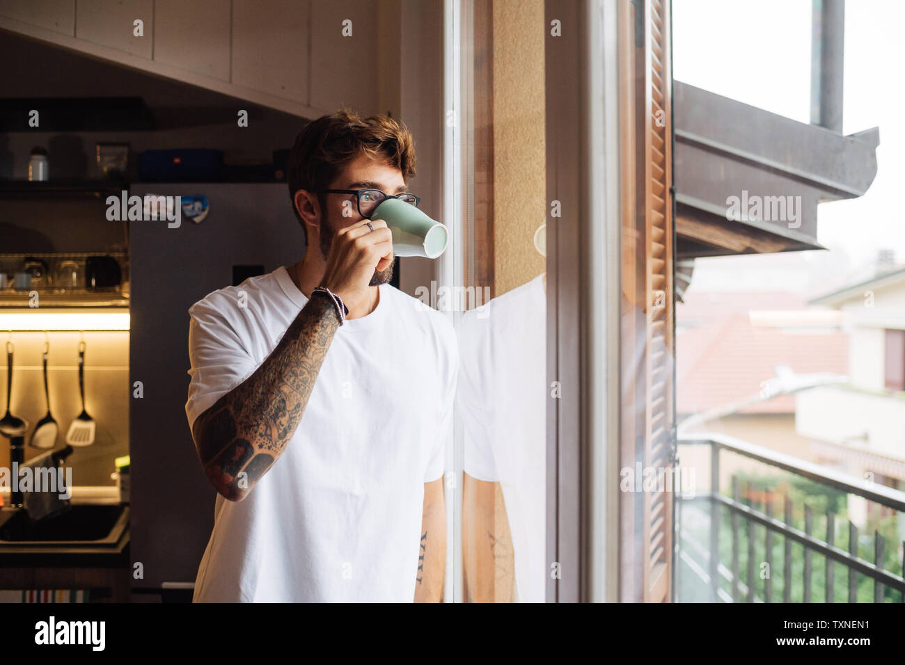 Man apartment window hi-res stock photography and images - Alamy