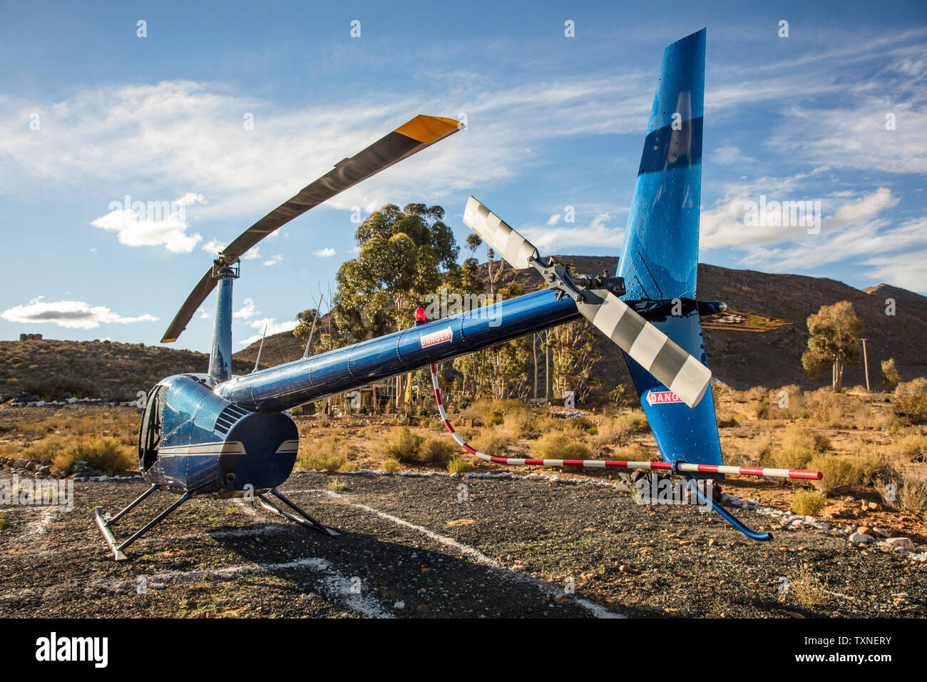 Helicopter on ground in rural landscape, rear view, Cape Town, Western ...