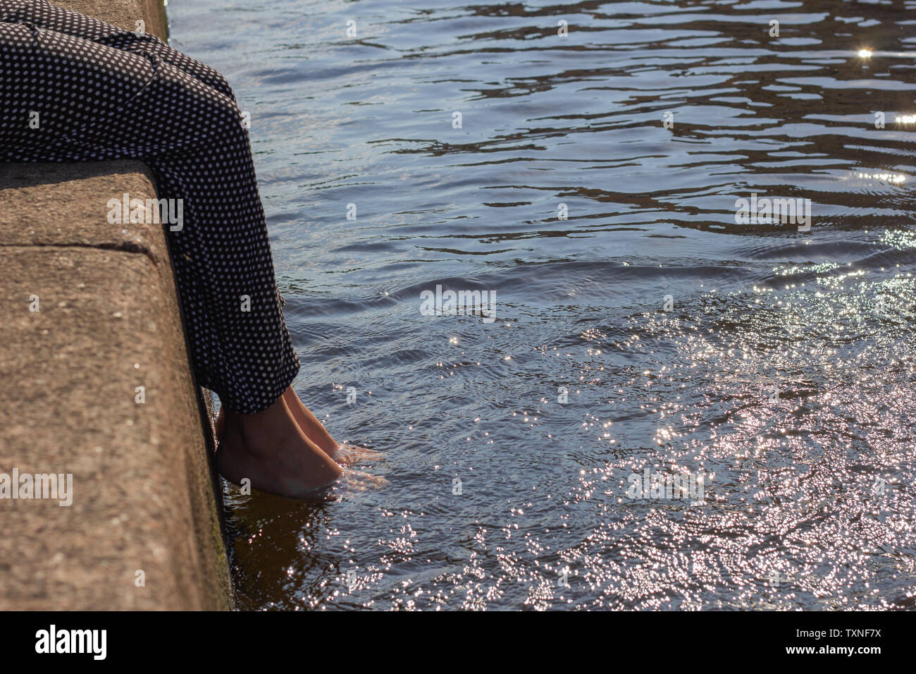 relaxation feet in the water refreshing Stock Photo - Alamy