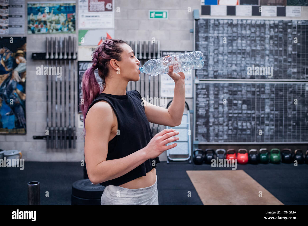 Woman drinking water gym hi-res stock photography and images - Alamy