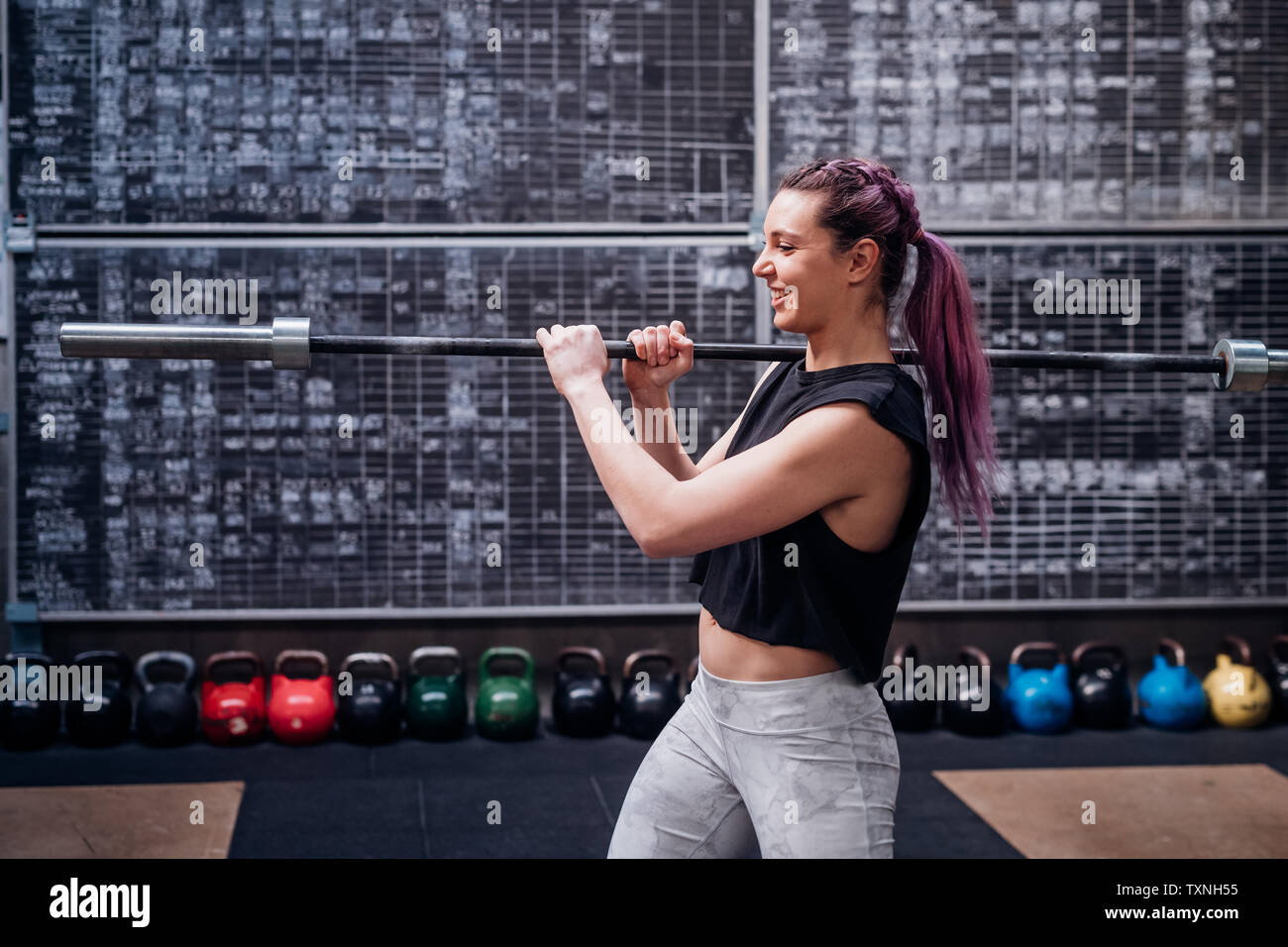 Woman lifting weight hi-res stock photography and images - Alamy
