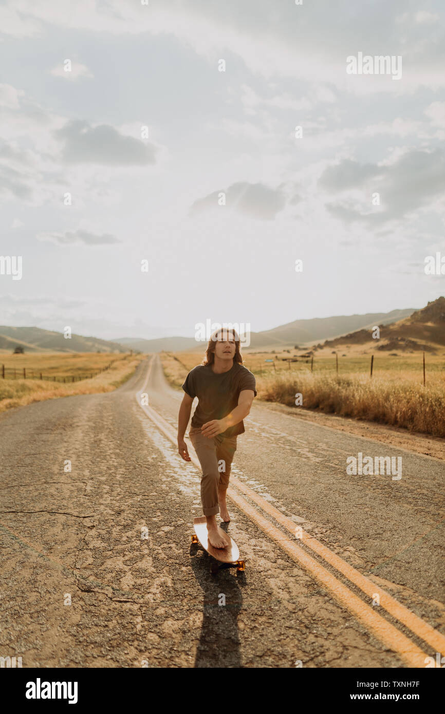 Barefoot man jeans hi-res stock photography and images - Alamy