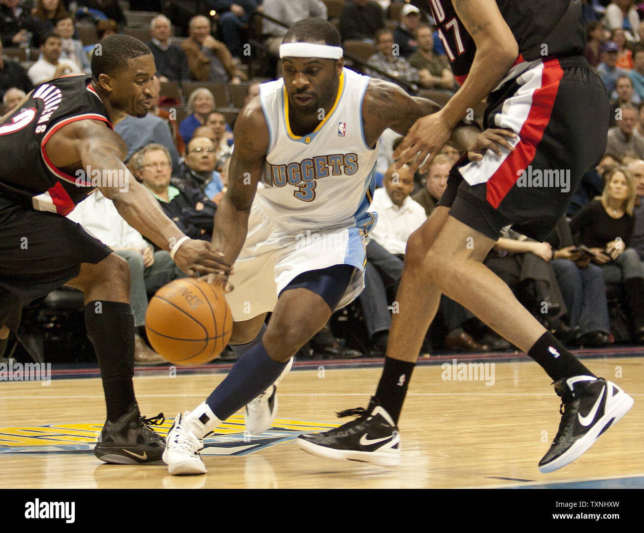 Denver Nuggets guard Ty Lawson drives past Portland Trailblazers Wesley ...
