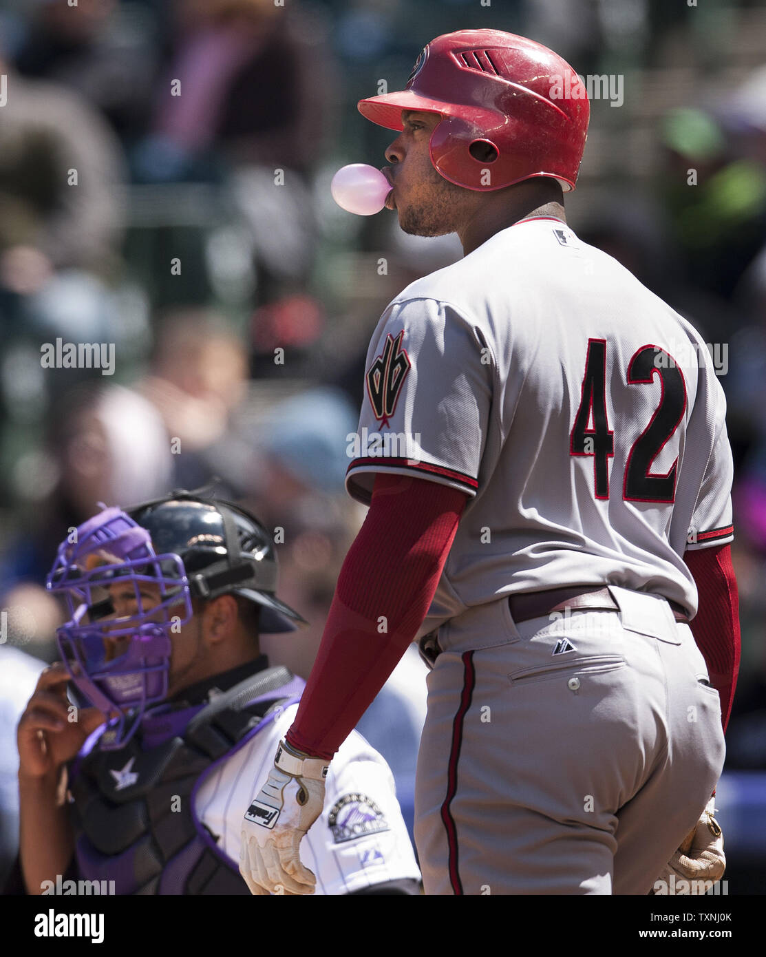 Arizona Diamondbacks right fielder Justin Upton blows a bubble awaiting ...