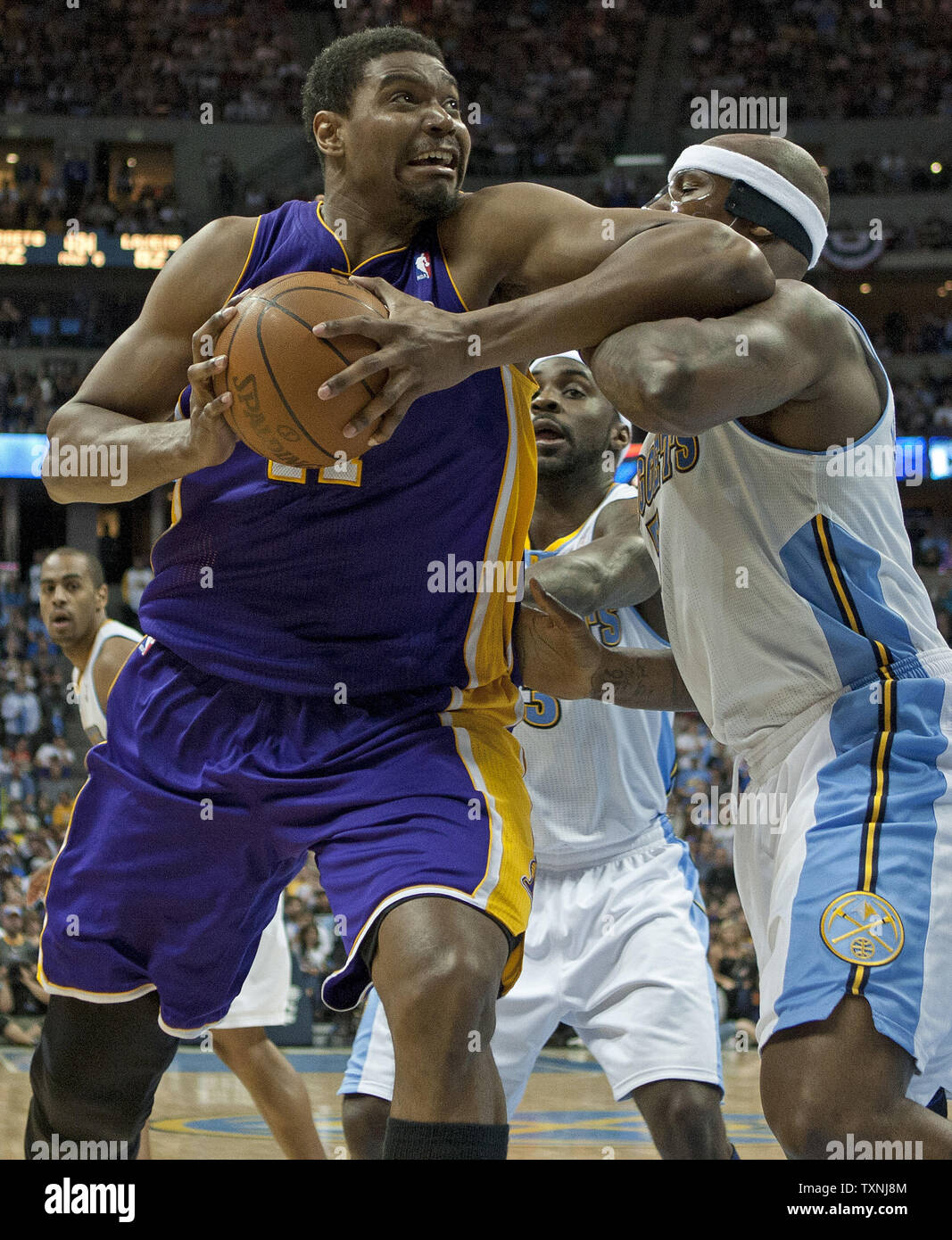 The Los Angeles Lakers center Andrew Bynum sends an elbow into the face ...