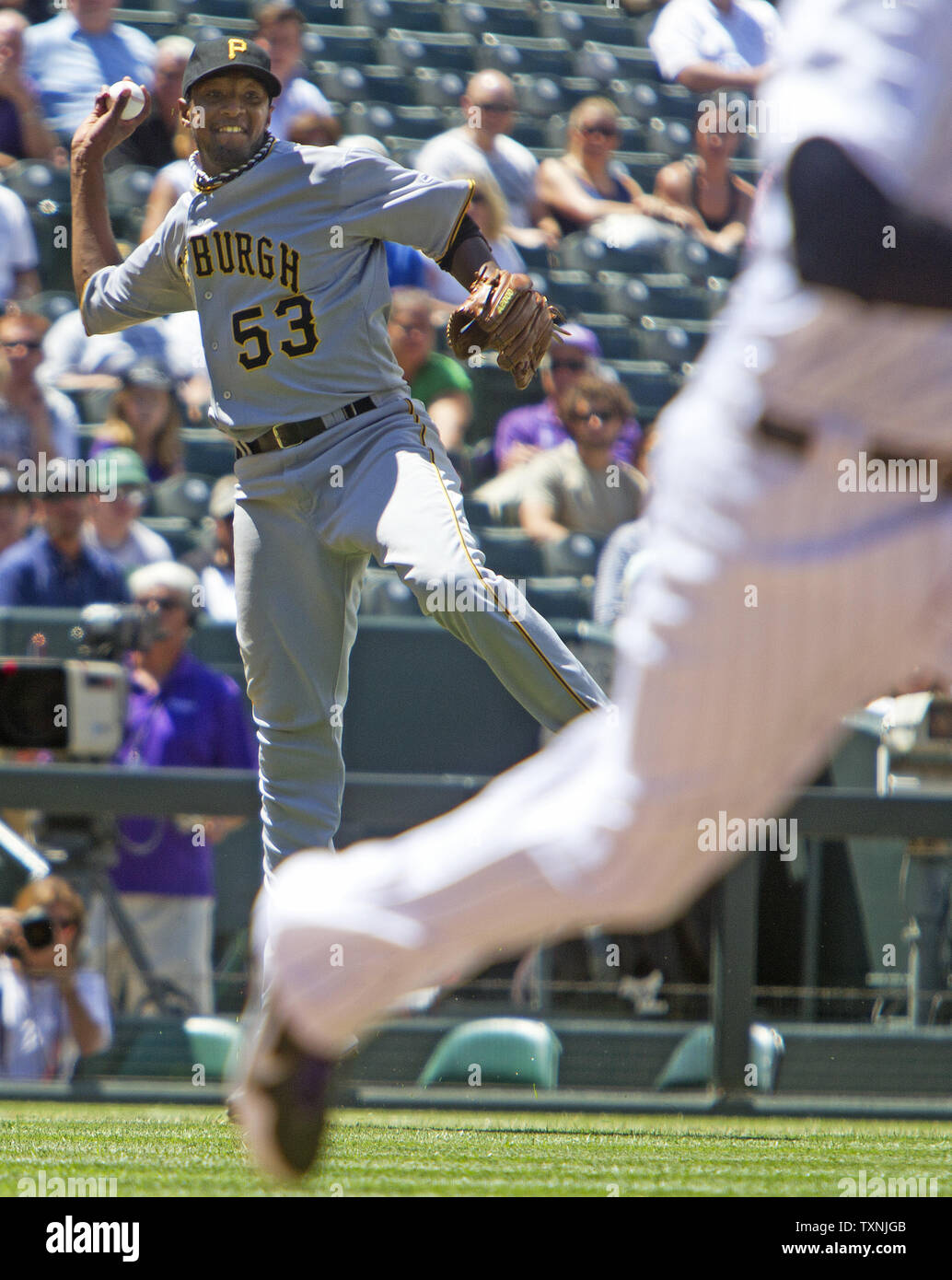 Pittsburgh Pirates pitcher James McDonald leaps to try and throw out ...