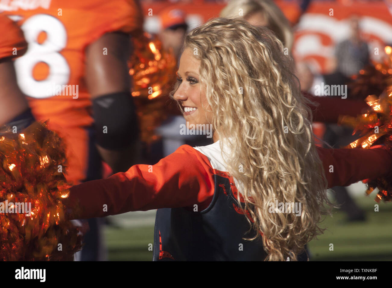 The Denver Broncos cheerleaders line a pathway for player introductions ...