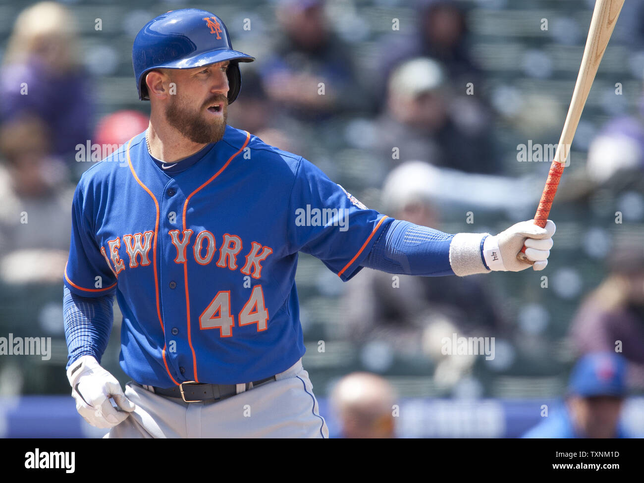New York Mets catcher John Buck bats against the Colorado Rockies at ...